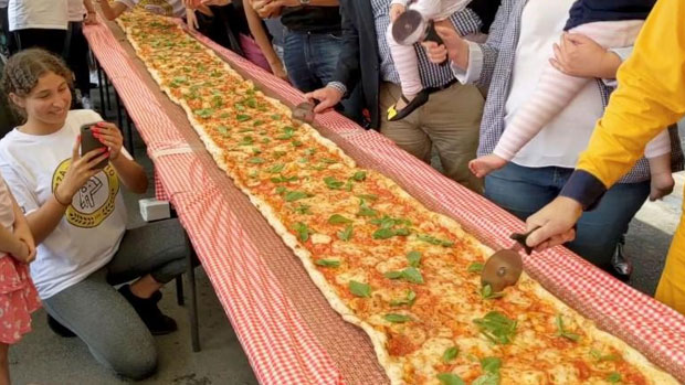 103 meter long pizza made to raise funds for firefighters battling ...