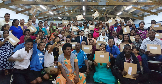 63 Omkar Settlement families are now the legal title holders of the lots